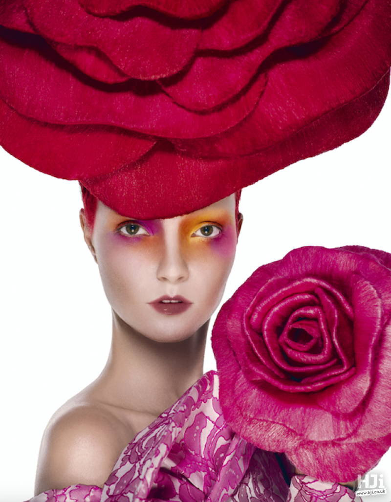 Avant garde styling with giant red rose