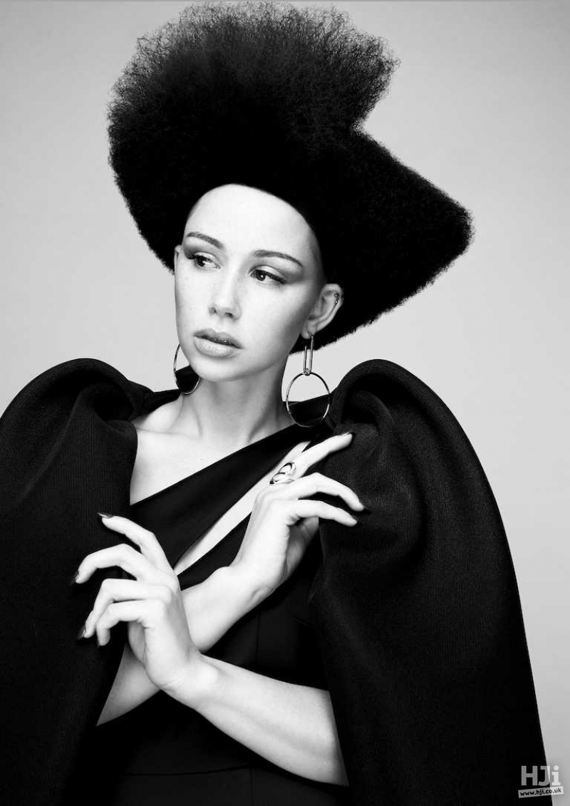 Avant garde style Afro with natural texture and geometric cut