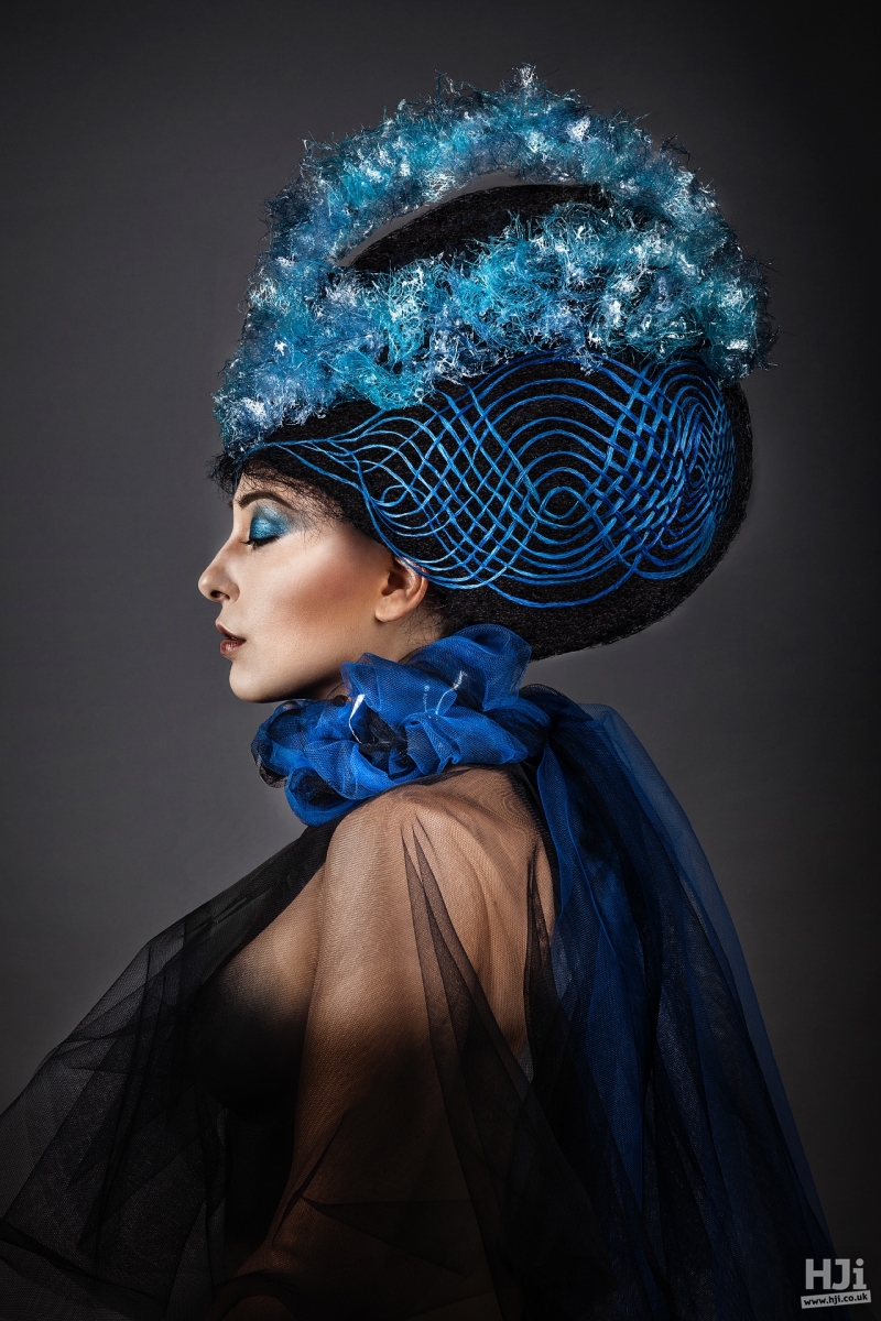 Avante-garde, blue and gold beehive with blue weaved accents and light ...