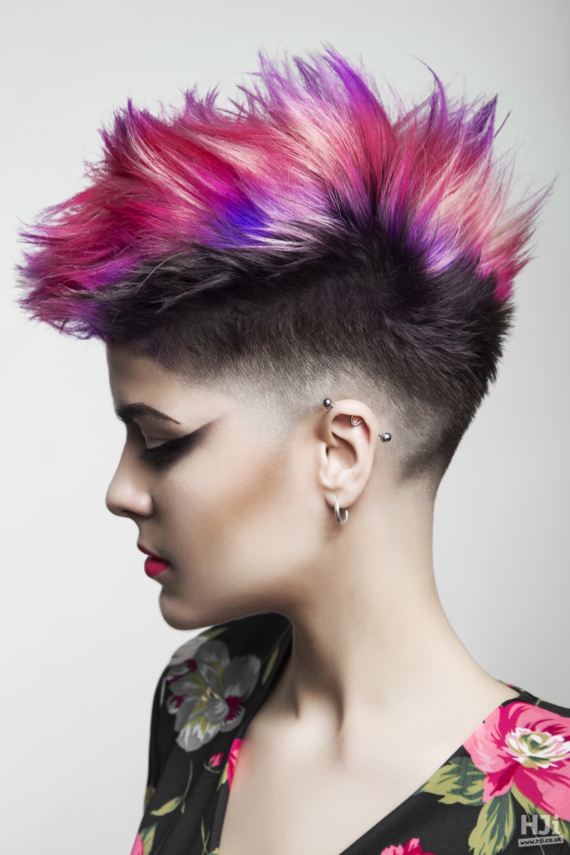 Creative colour pink, purple and rose gold mohawk with brunette fading