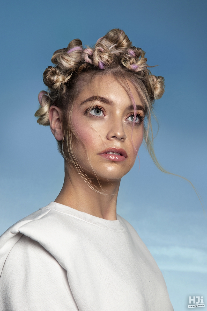 Light violet shaded buns on blonde hair