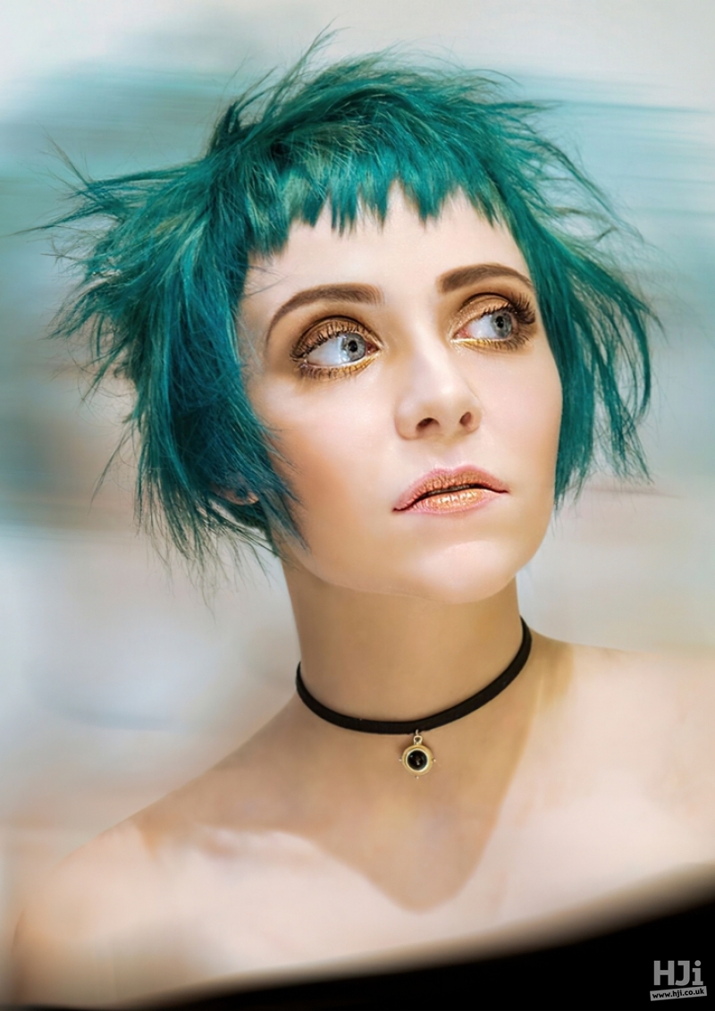 Messy teal bob cut with short fringe