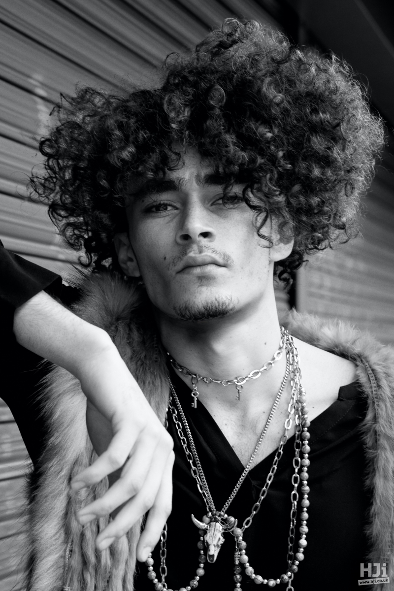 Natural men's afro with centre parting