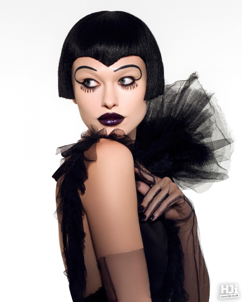 Sleek black bob with pointy fringe